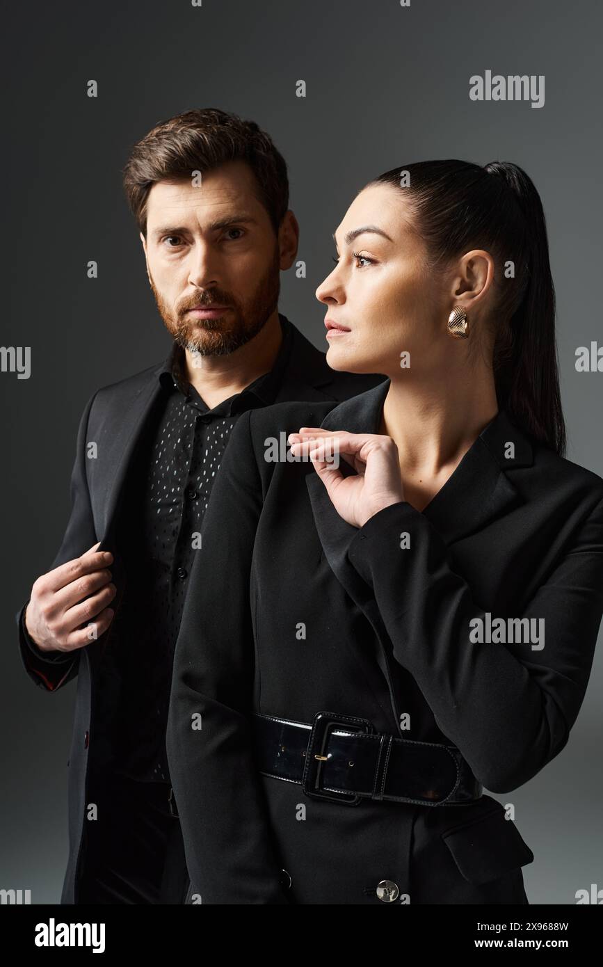 A loving couple in elegant attire standing together Stock Photo - Alamy