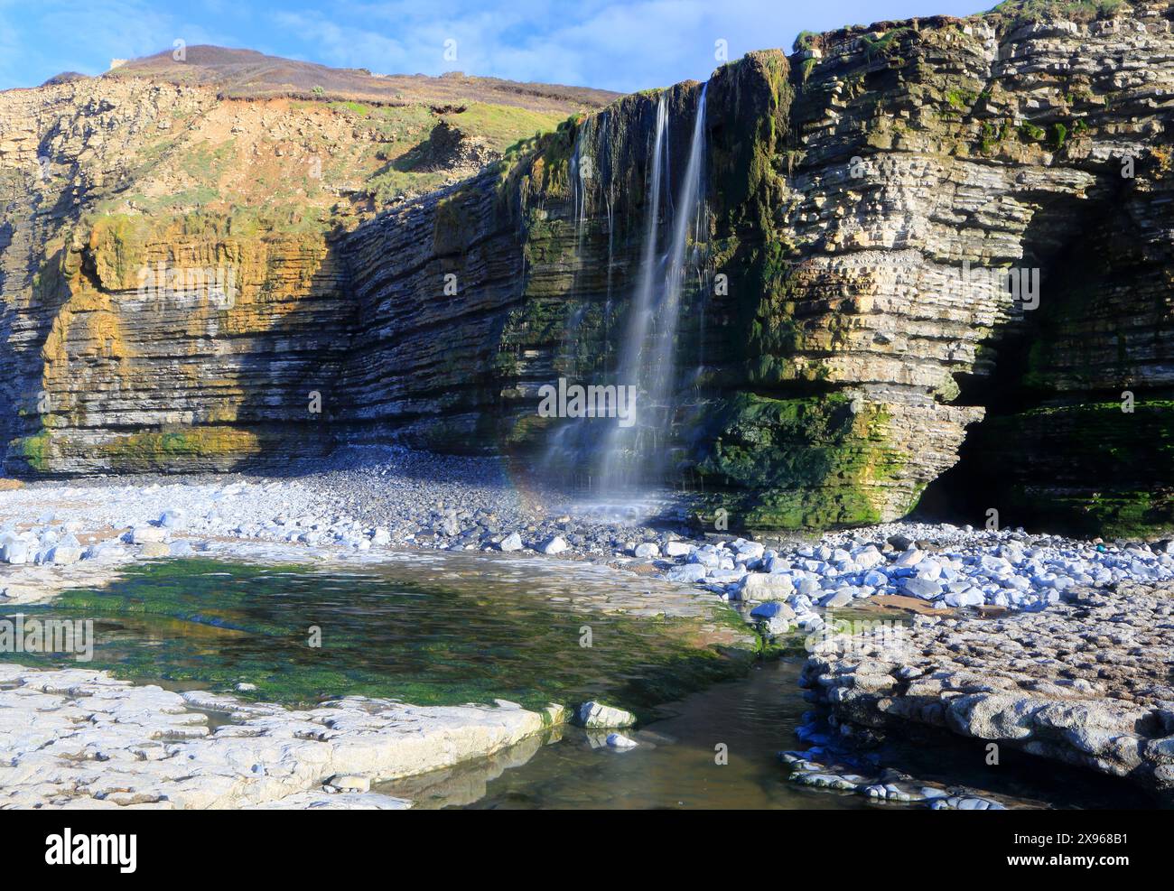 Waterfall at Cwm Bach, Traeth Bach Beach, near Southerndown, Glamorgan ...