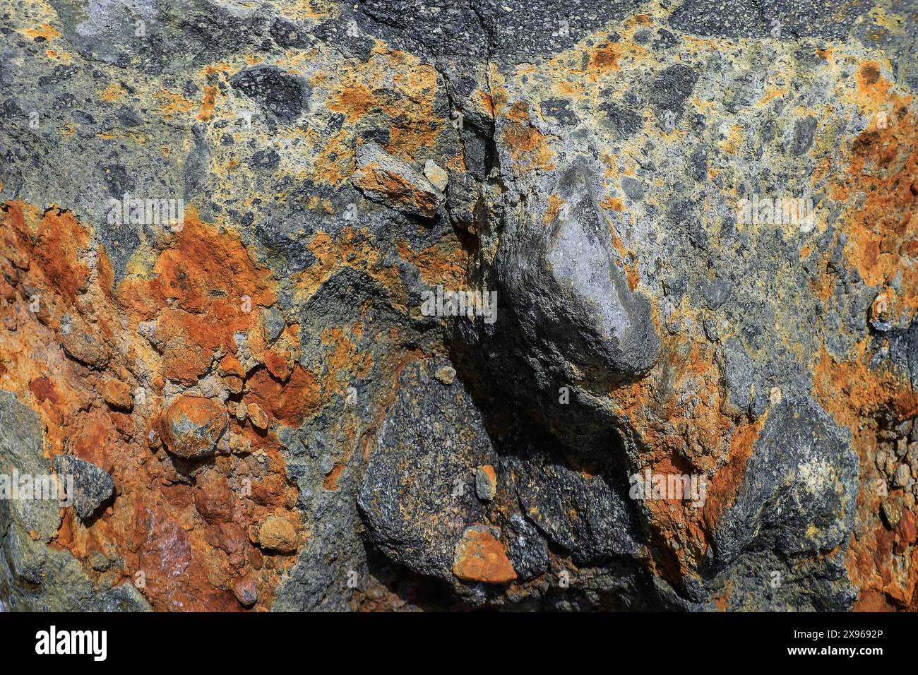 Sulphur deposits in a piece of lava rock on the slopes of Mount Lokon ...
