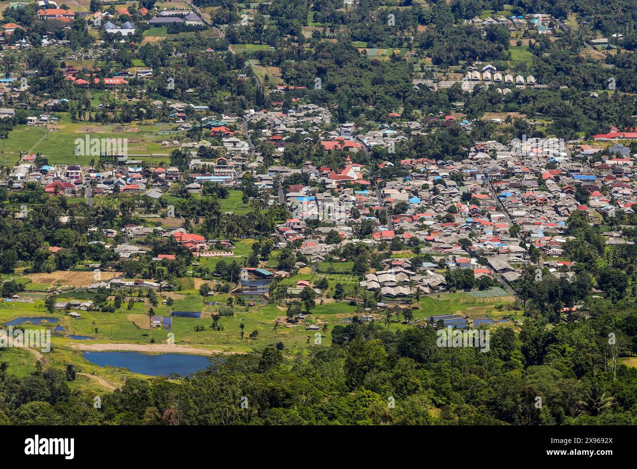 Tomohon City, sited close to four volcanoes, two of them active, known ...