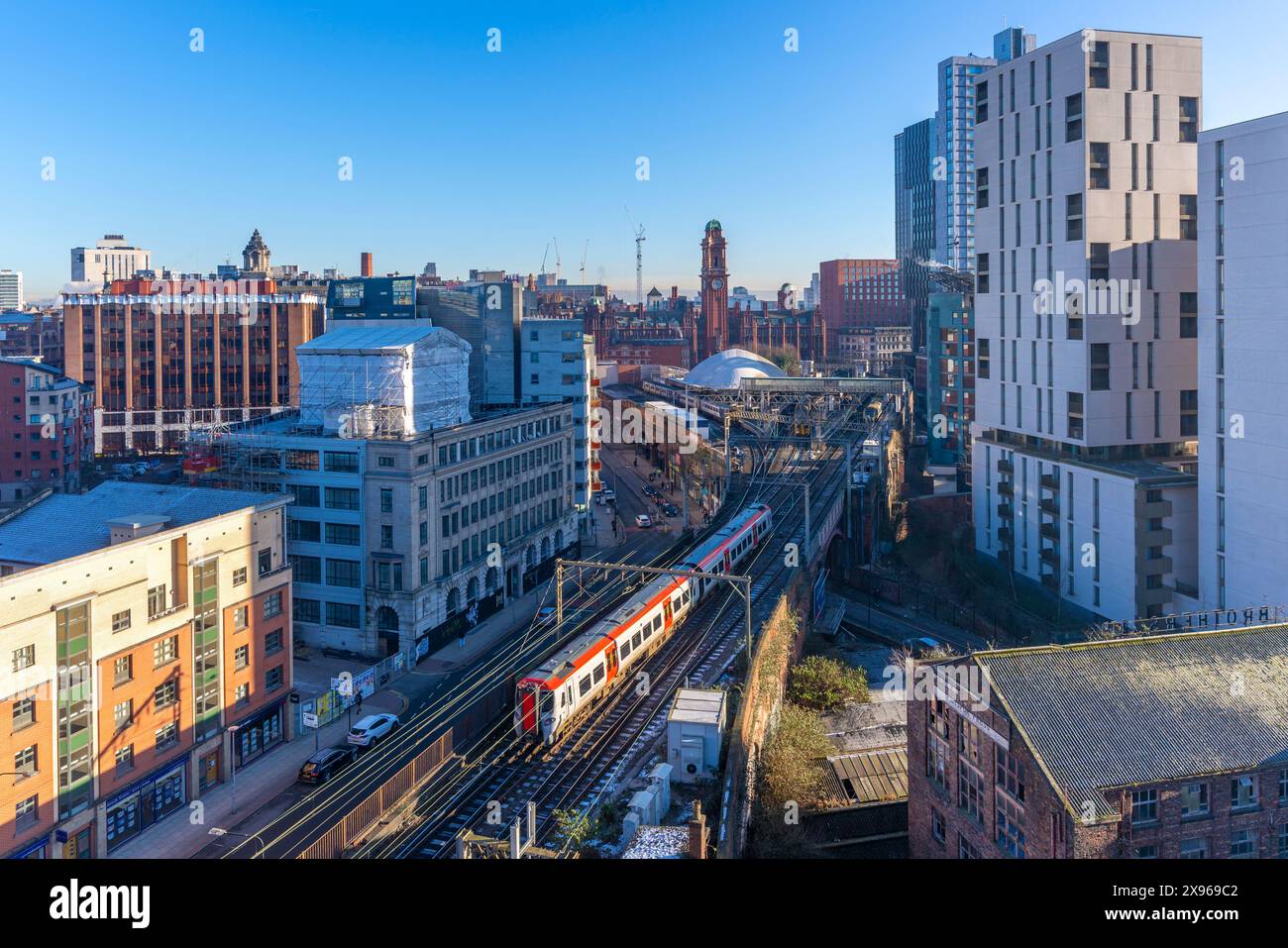 Elevated view of city skyline from Tony Wilson Place, Manchester ...