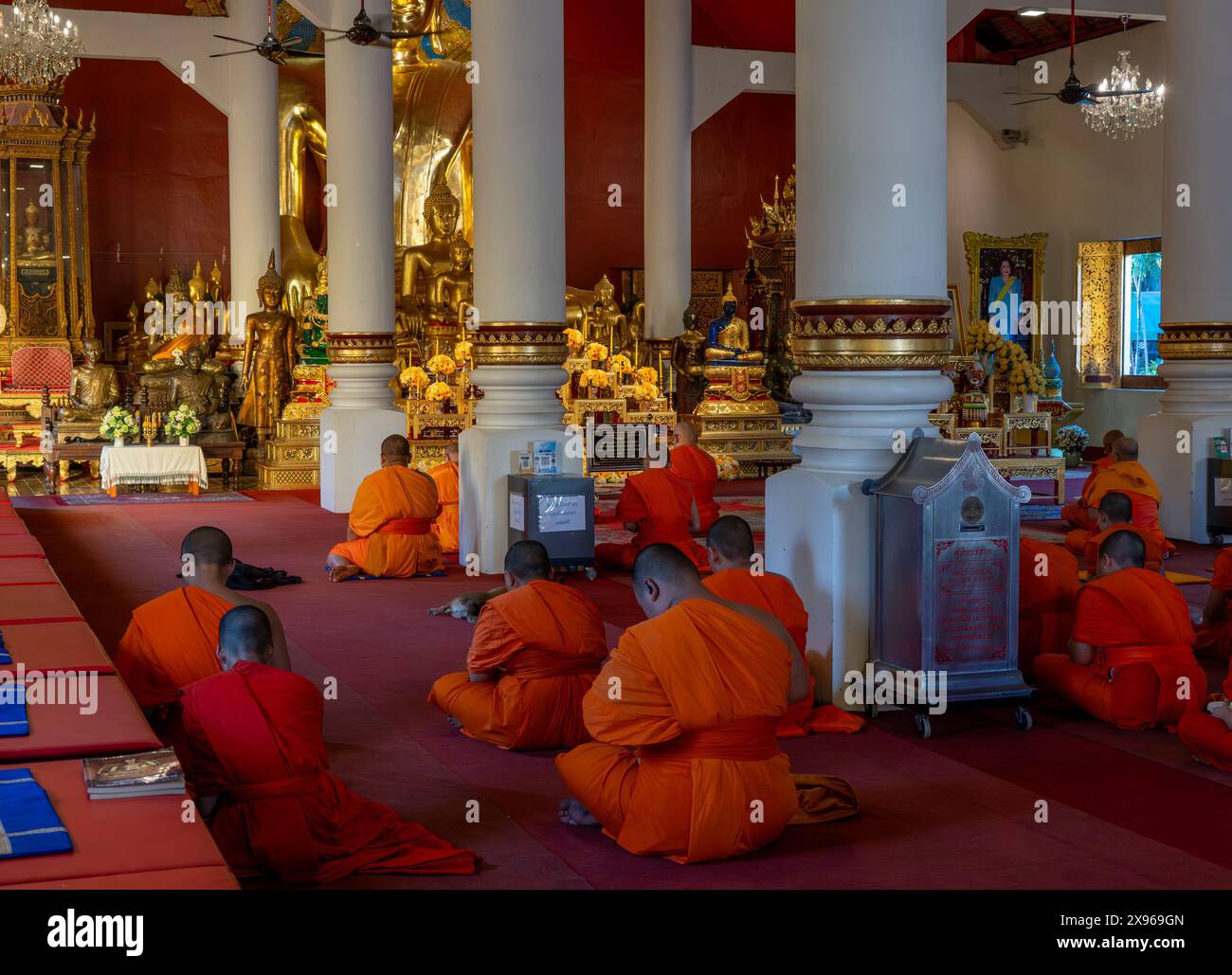 Monks praying and chanting at a Buddhist temple in Chiang Mai, Thailand ...