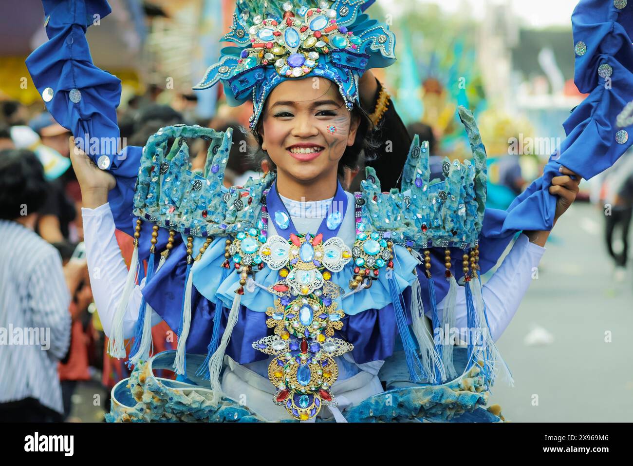 Girl in elaborate costume, annual Tomohon International Flower Festival ...