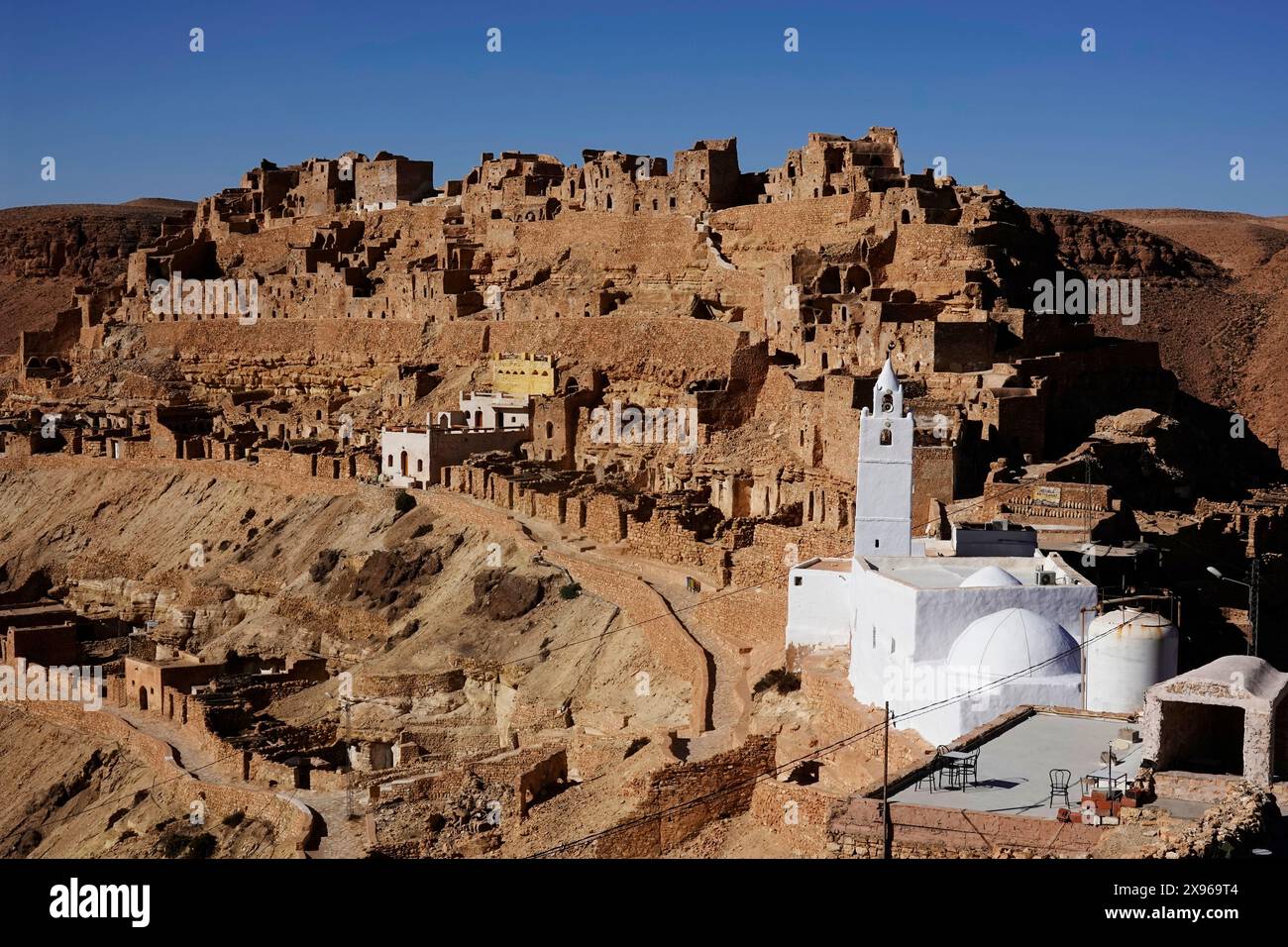 The hilltop town of Chenini, known for its Berber troglodyte structures ...