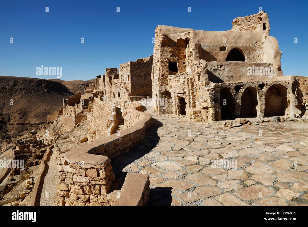 The hilltop town of Chenini, known for its Berber troglodyte structures ...