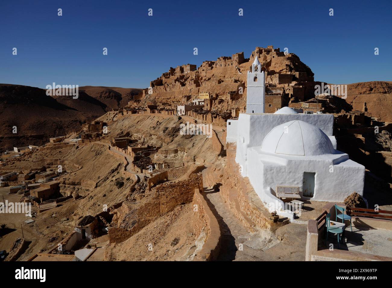The hilltop town of Chenini, known for its Berber troglodyte structures ...