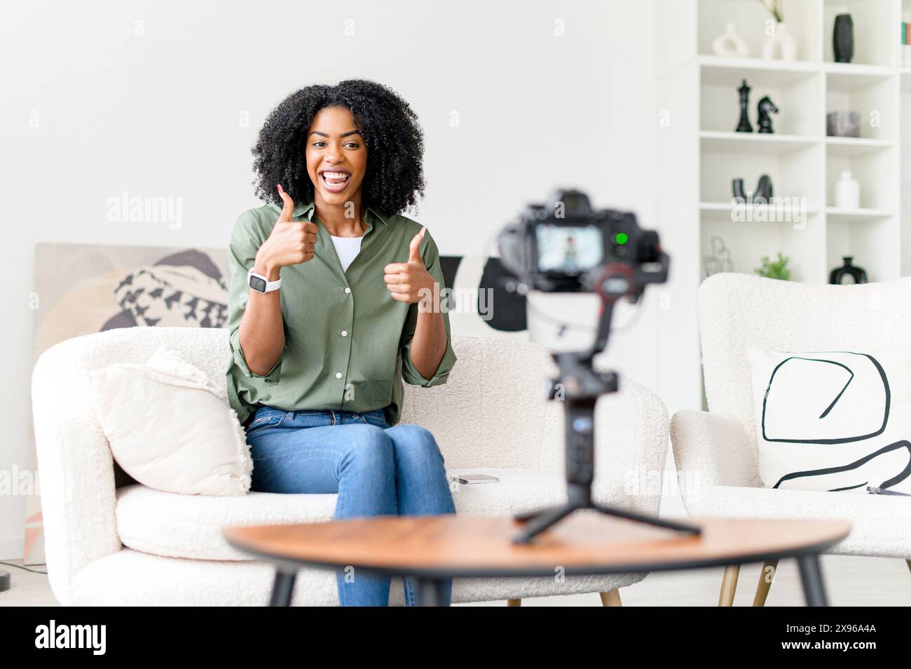 Full of energy and charisma, an African-American vlogger records a ...