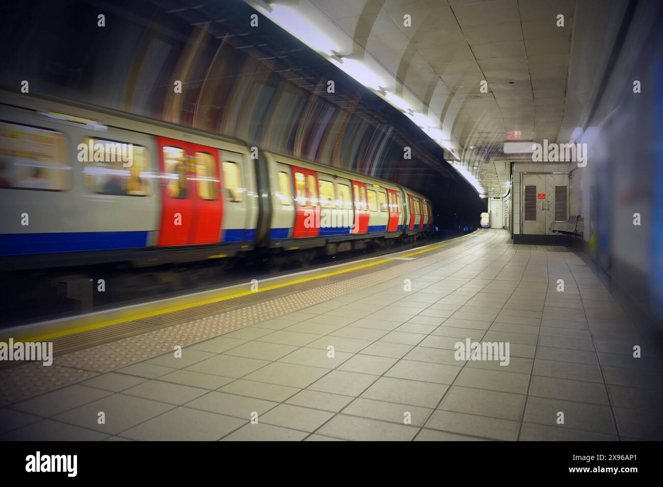 blurred Metropolitan Railway train speeding, quick and efficient ...