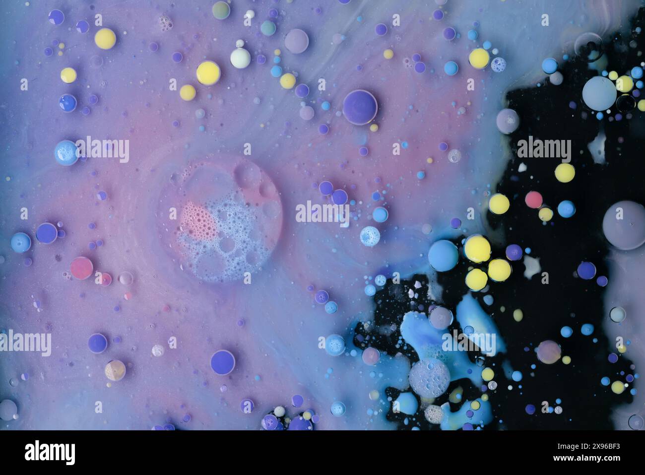A myriad of oil droplets intermingling with water, creating a ...