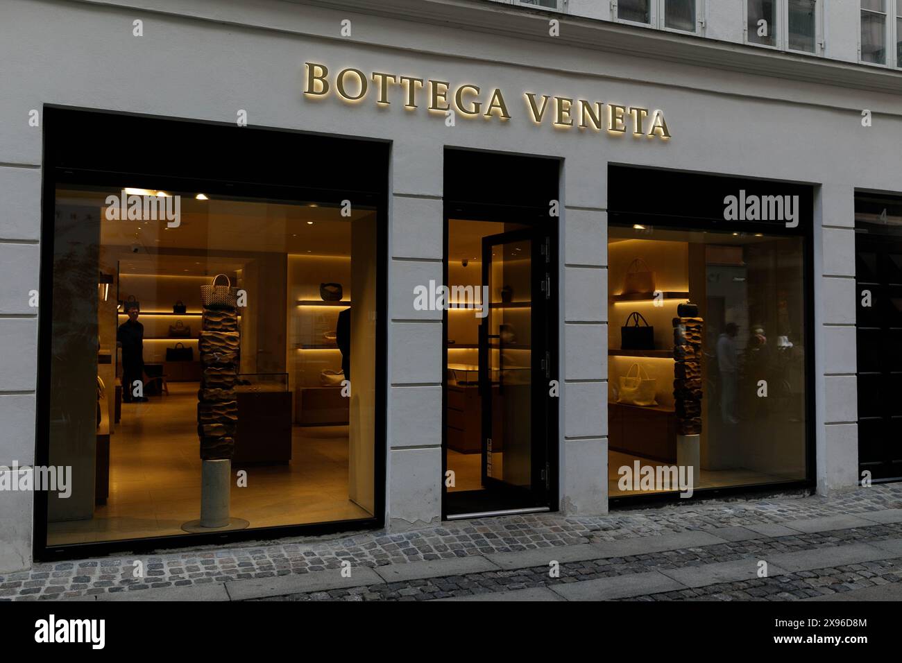 The Bottega Veneta logo is visible on the store, located in the center ...