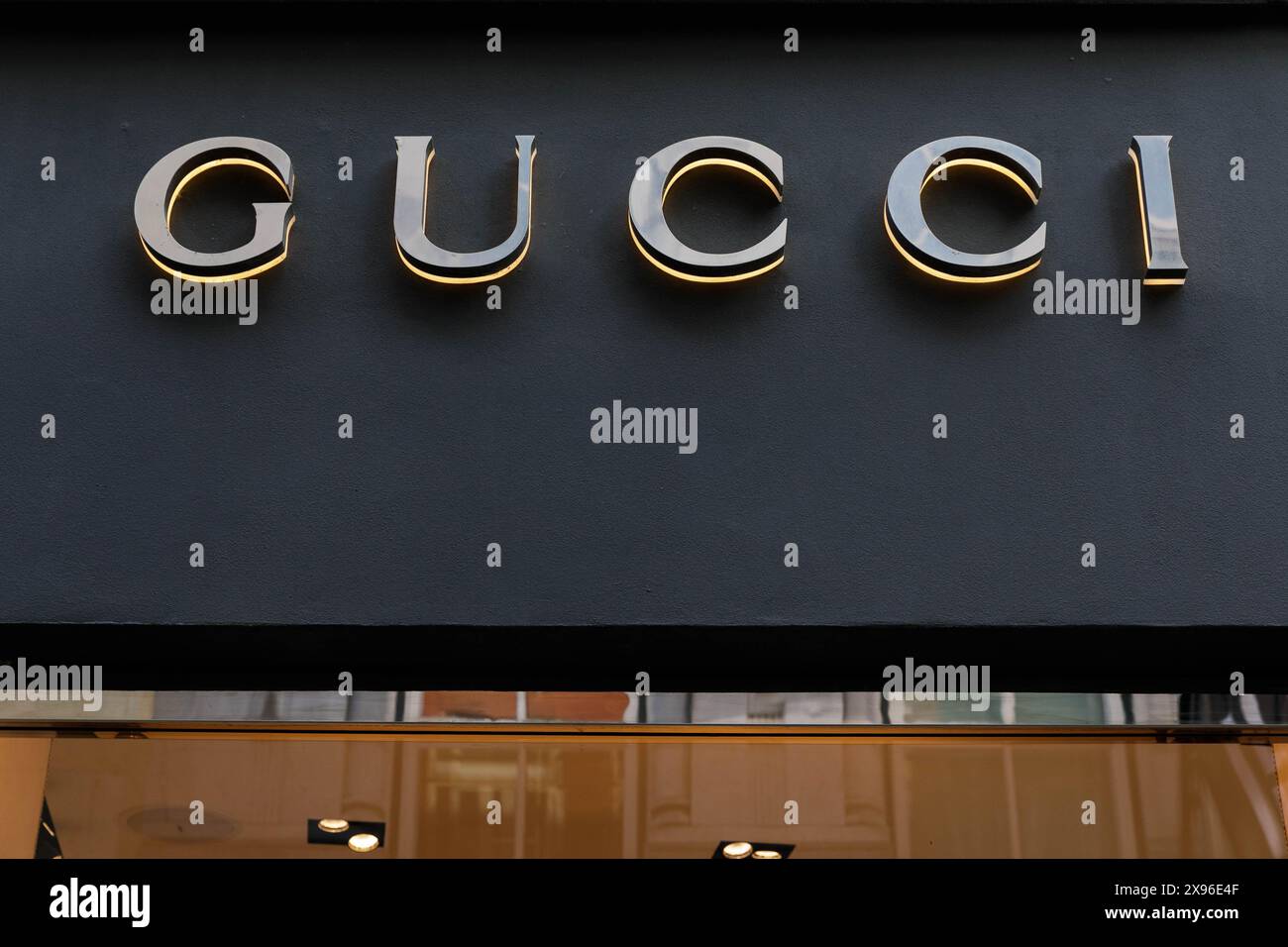 The Gucci logo is visible on the store, located in the center of ...