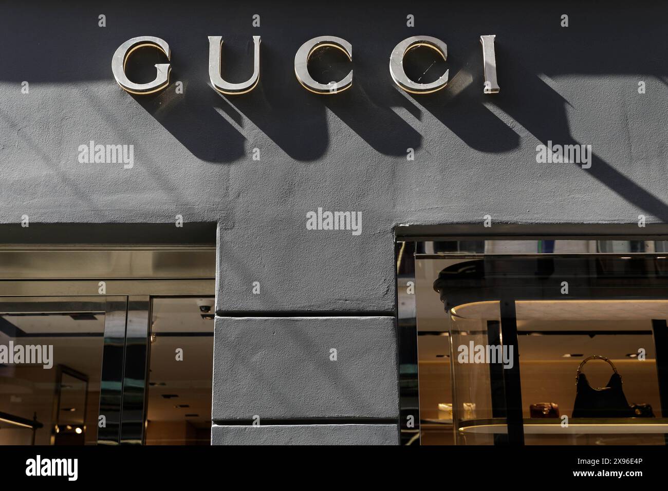 The Gucci logo is visible on the store, located in the center of ...