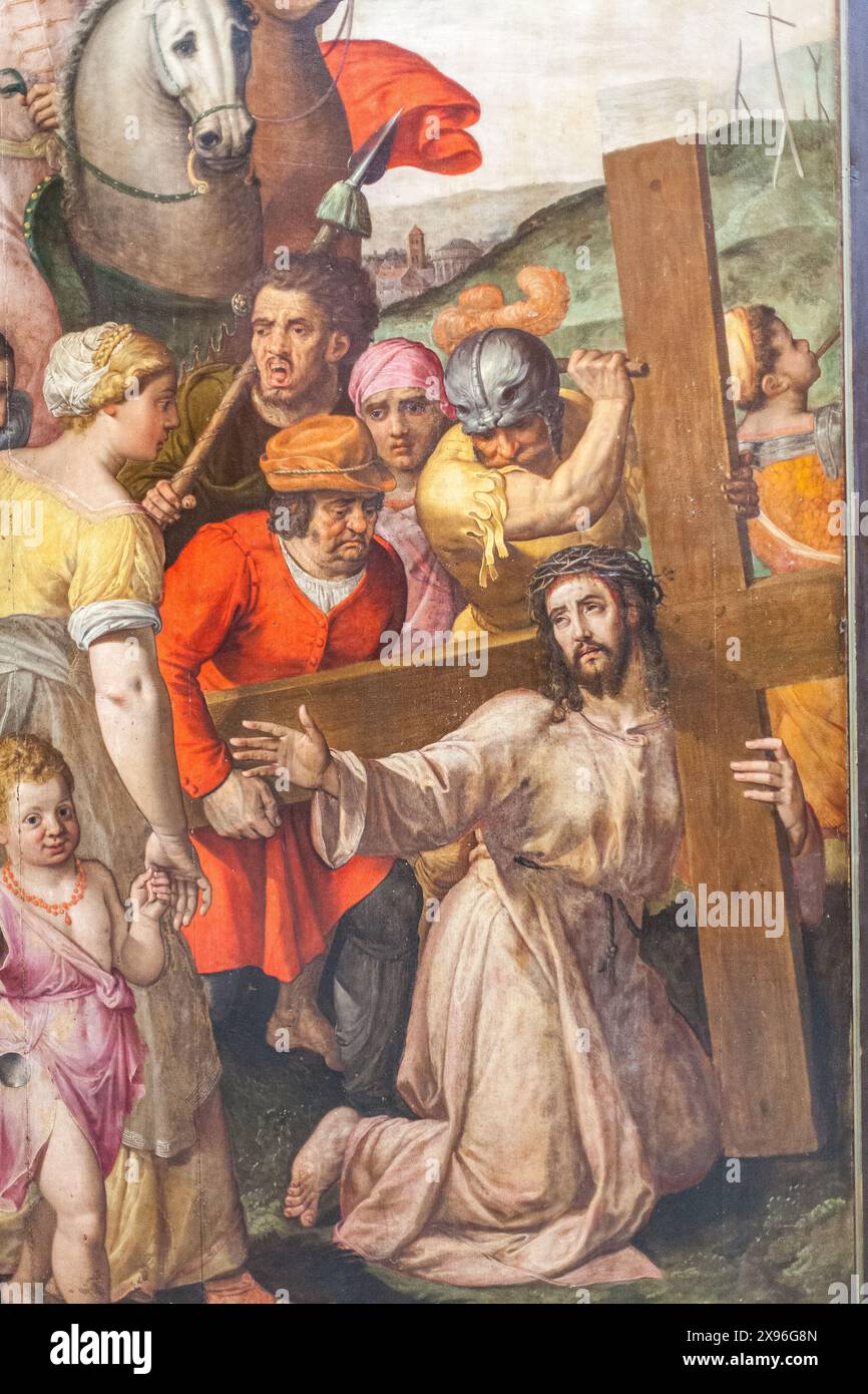 Jesus carries the cross surrounded by followers and onlookers in a vivid depiction of Calvary ...