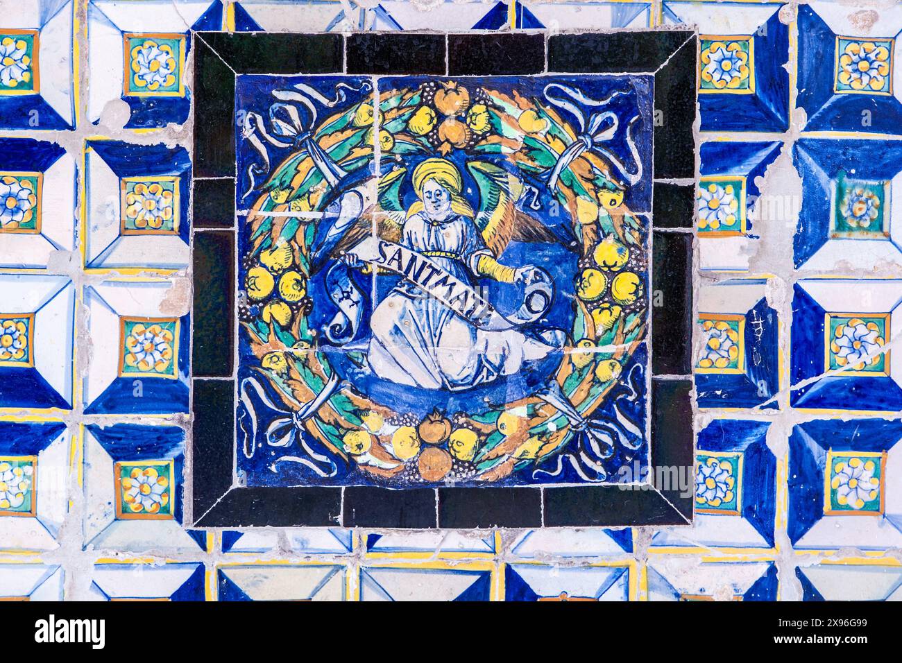 Antique ceramic tiles depicting Saint Matthew adorned with rich colors ...