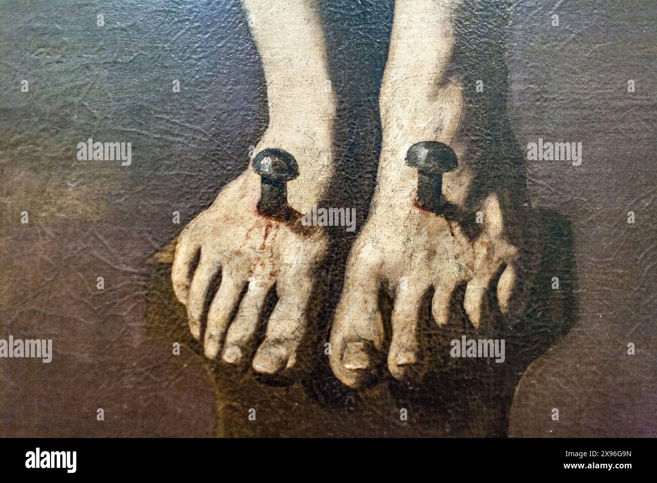 Detail showing nailed feet of Dying Christ from a 17th-century painting by Zurbarán, located in ...