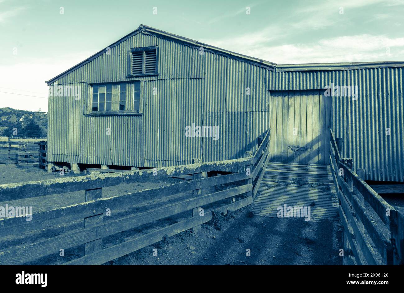 Aged image effect old corrugated iron shearing shed with outside yard ...