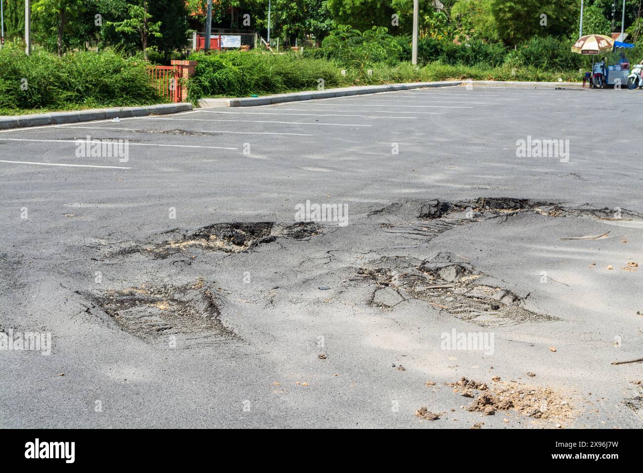 Asphalt surface on the car park was demolished due to poor construction ...