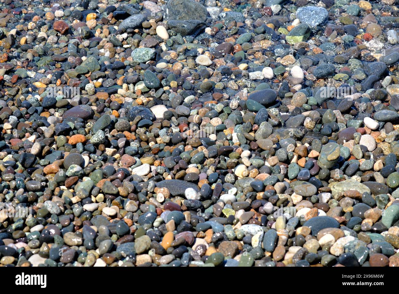 pebbles on the beach. Pebble beach background Stock Photo - Alamy