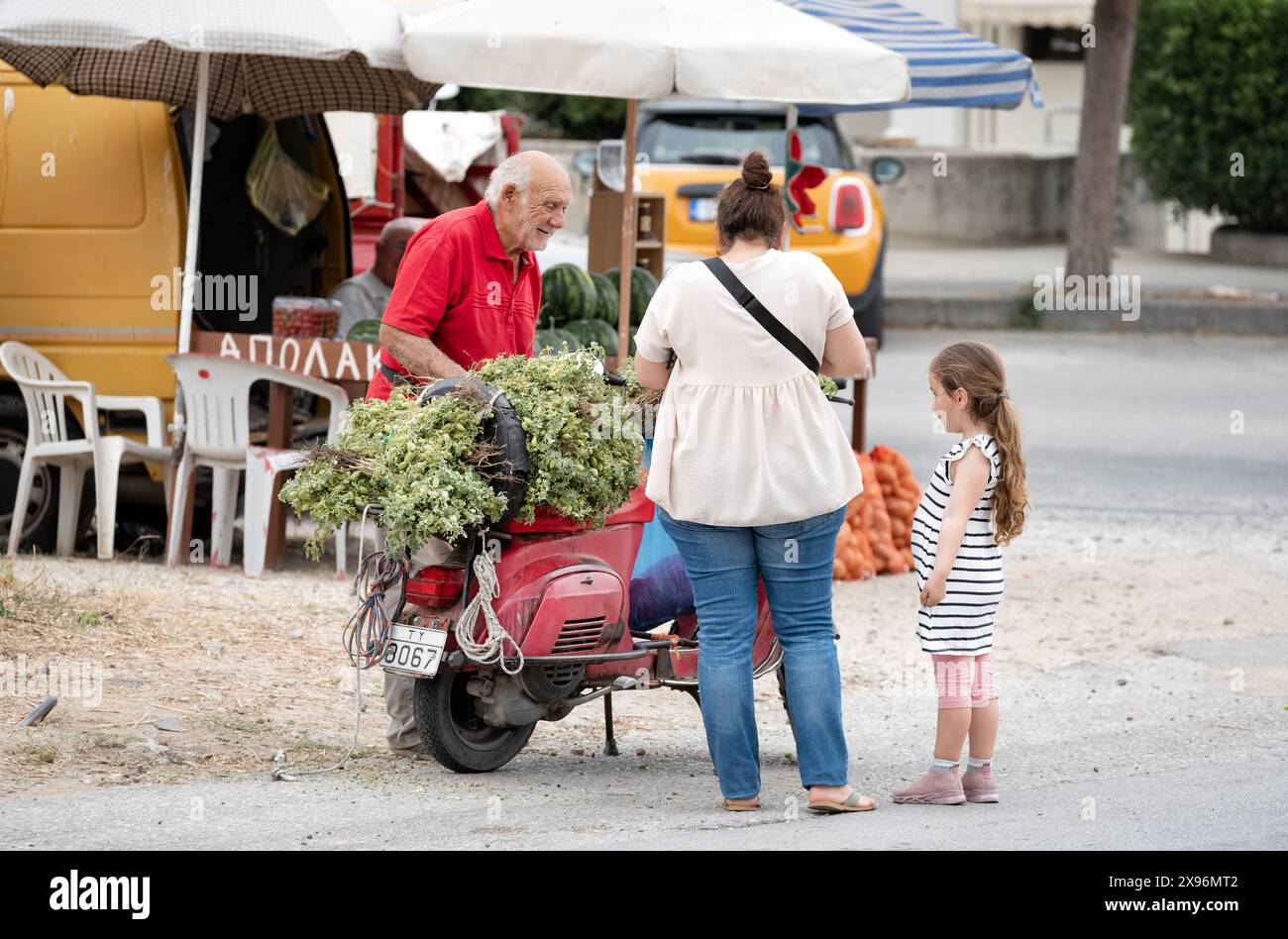 Rhodes, Greece. An old motor scooter loaded down with freshly cut ...