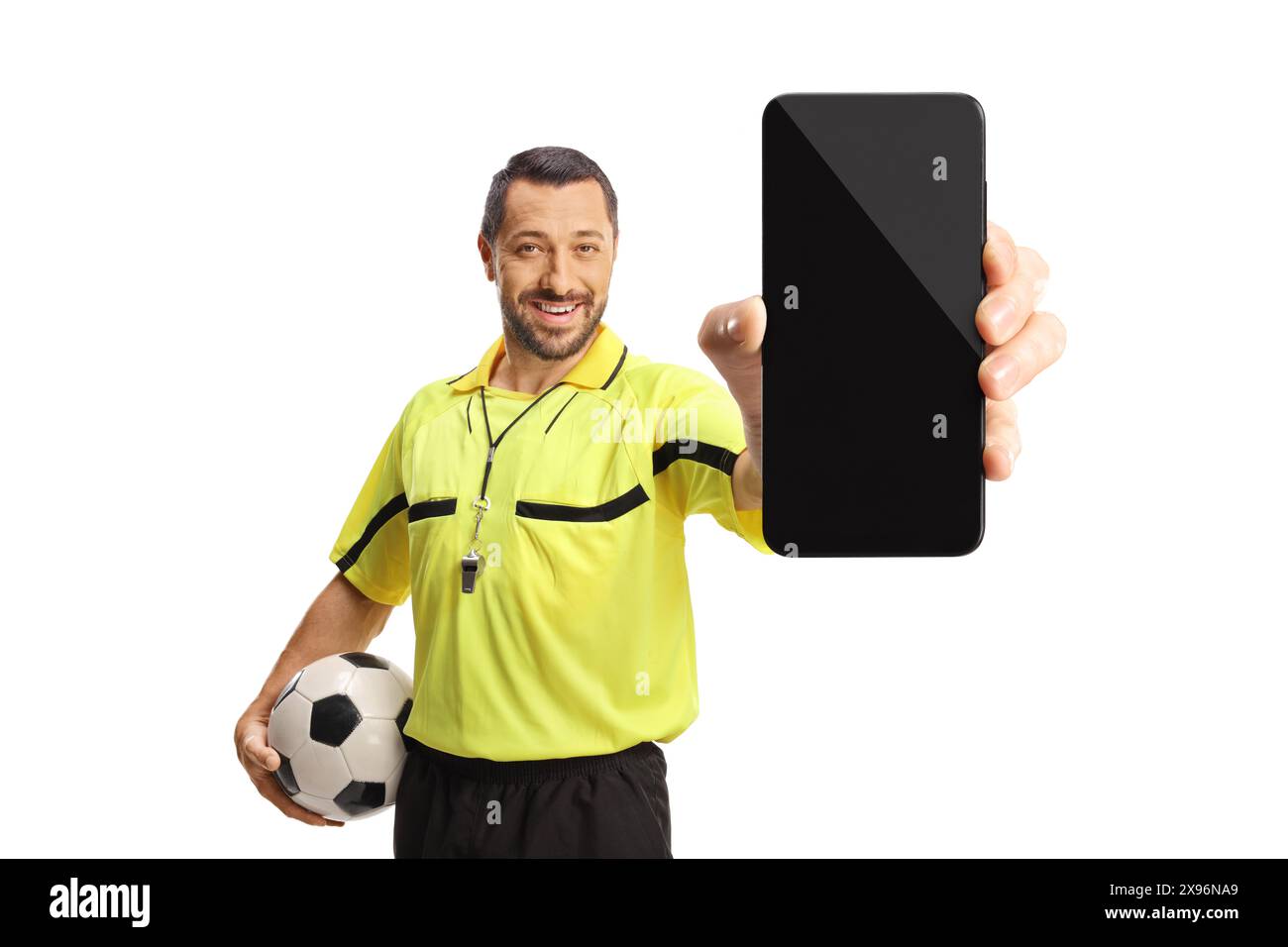 Football referee holding a ball and showing a smartphone isolated on ...