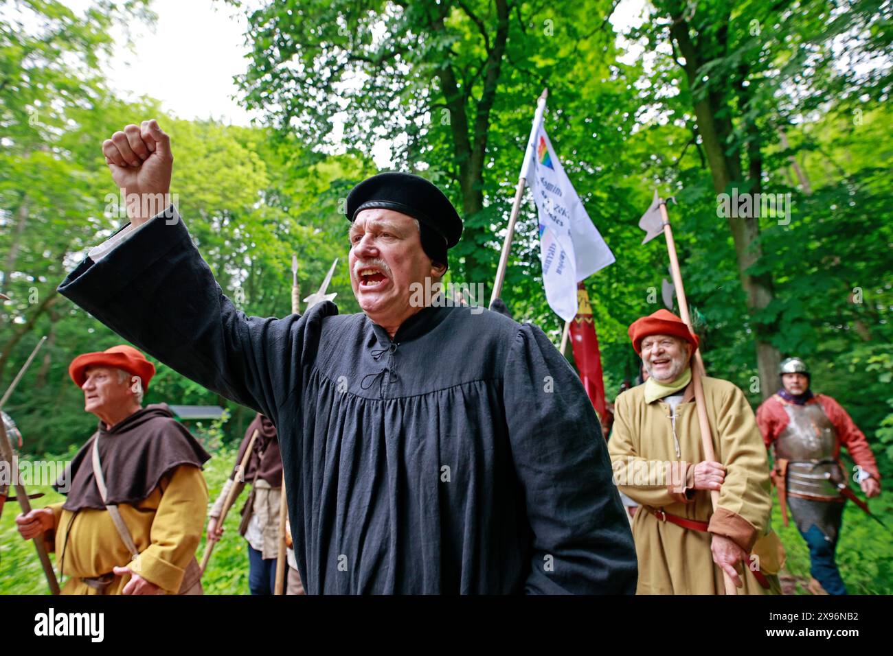 29 May 2024, Thuringia, Sondershausen: Actors dressed as peasants from ...