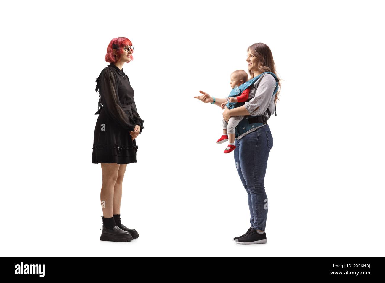 Mother with a baby talking to a woman in a black dress isolated on ...