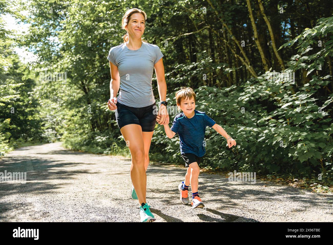 Parents child running in forest hi-res stock photography and images - Alamy