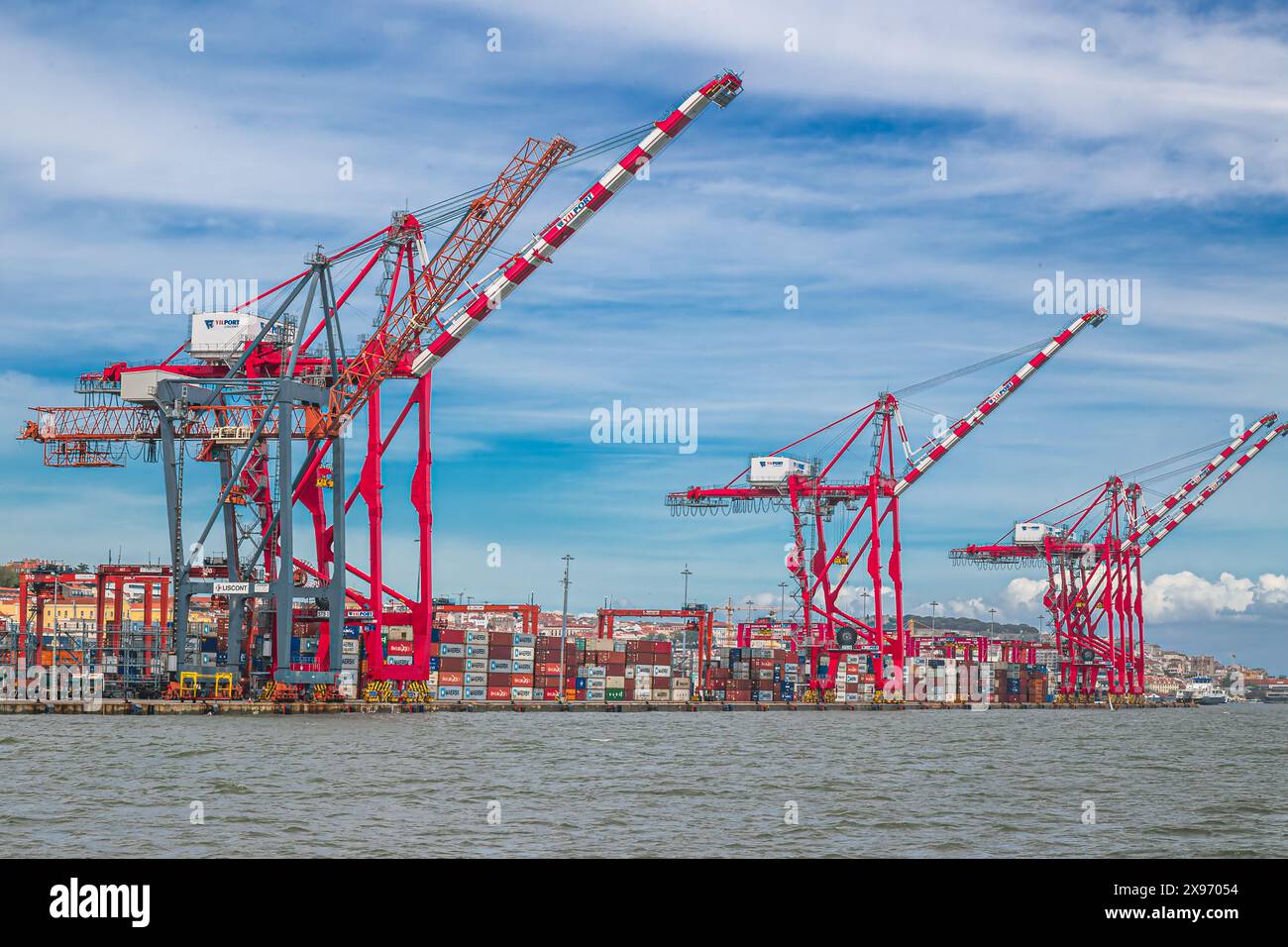 Red cranes and ships containers in the Port of Lisbon (Porto de Lisboa ...