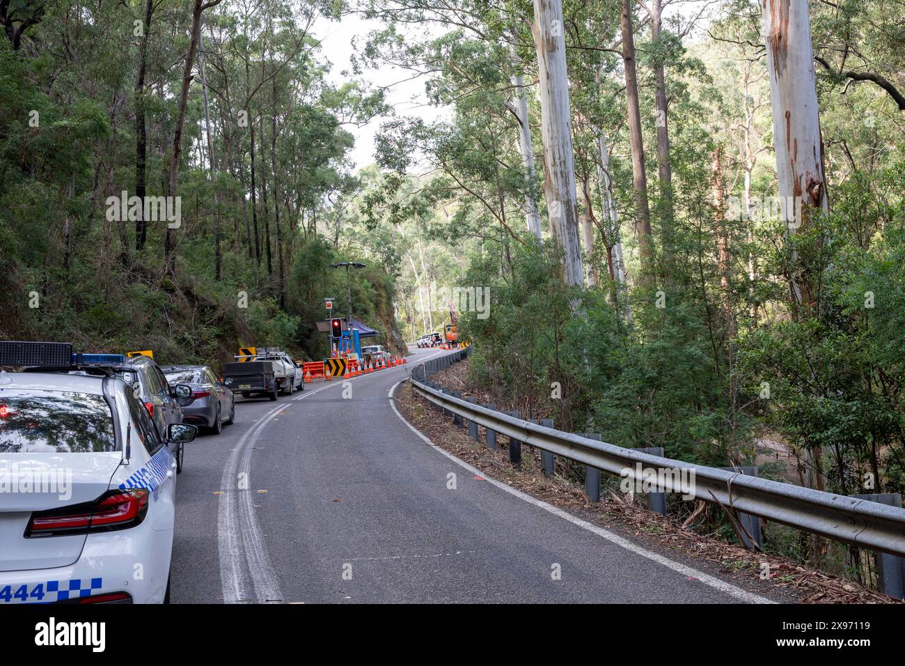 Roadworks delaying traffic including a NSW Police BMW car on Putty road ...