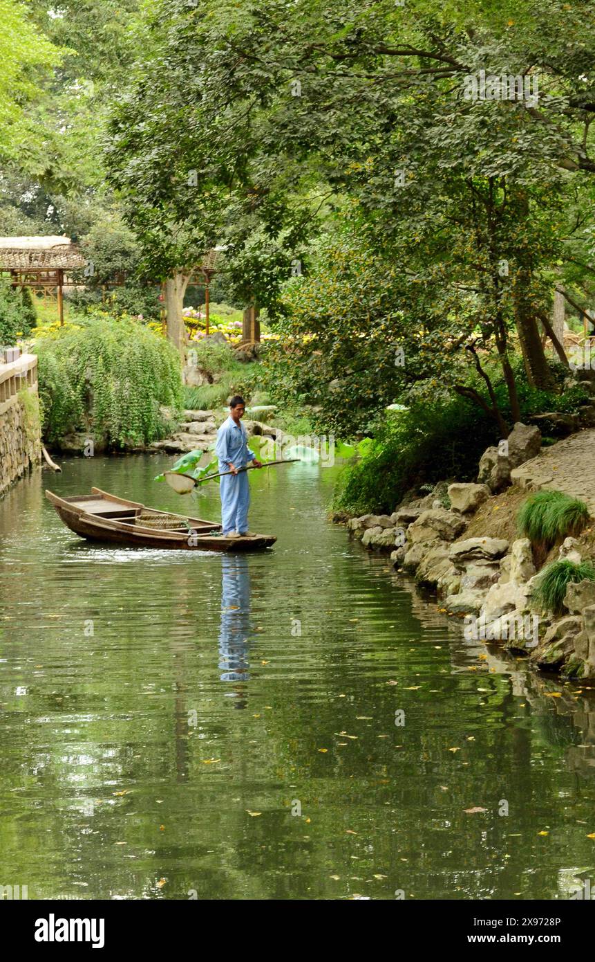 Boatman and Reflection on Lake in Humble Administrator`s Garden Humble ...