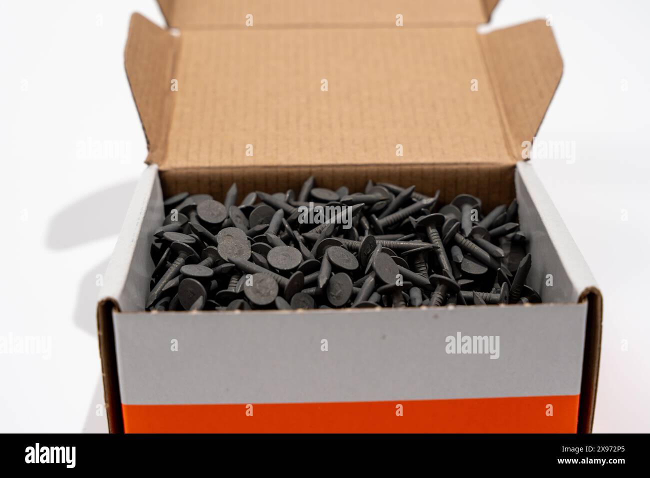 A box of nails for roofing. Roof nails isolated on white background ...