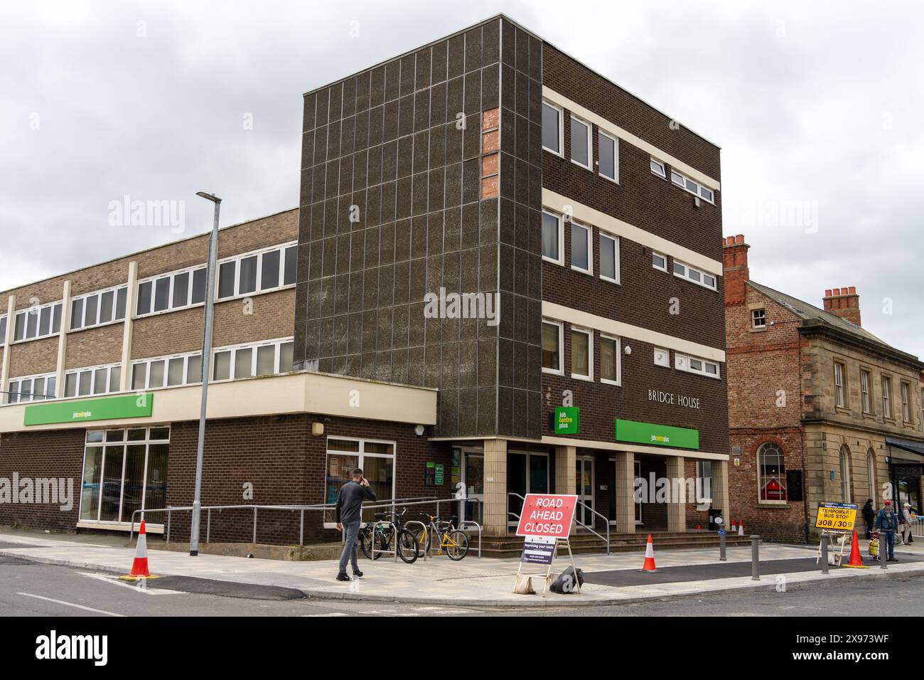 Blyth, Northumberland, UK. People outside the Job Centre Plus offices ...