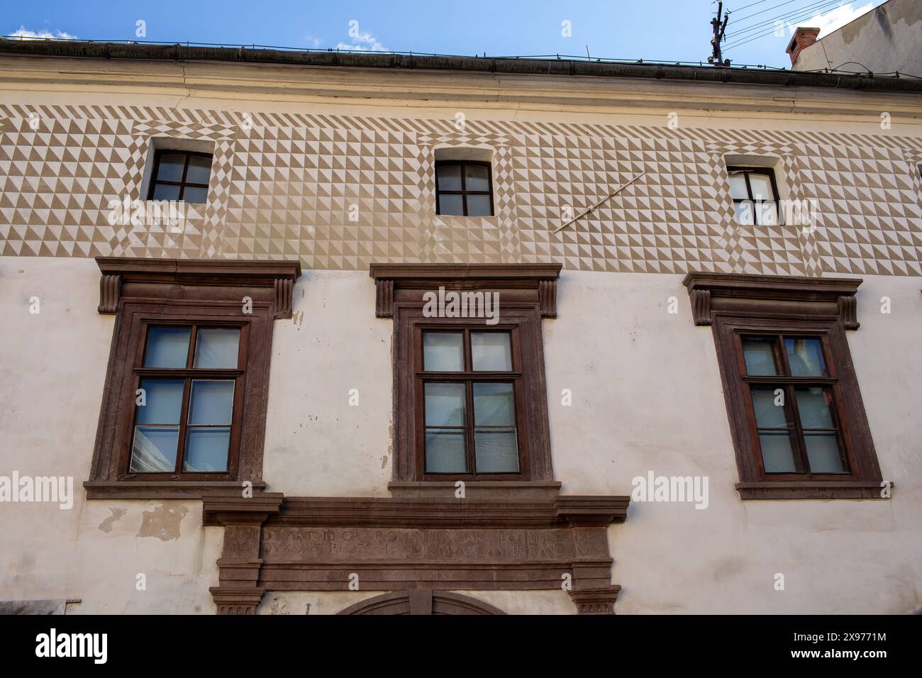 Sgraffito wall decor on the facade of historical building.Banska ...