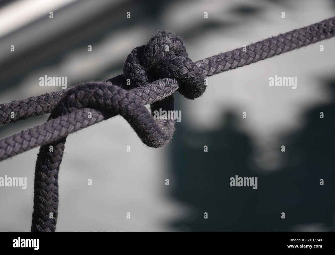 Marine-Grade Double-Braided Nylon mooring rope tied at a luxury yacht ...