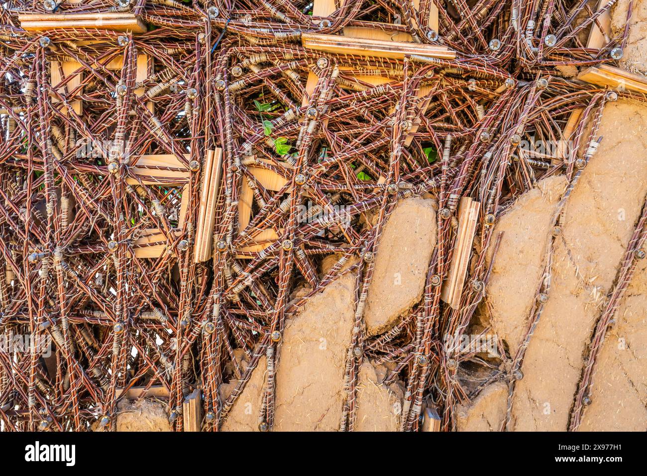 Detail of modern pavillon wall made of natural material clay and willow ...