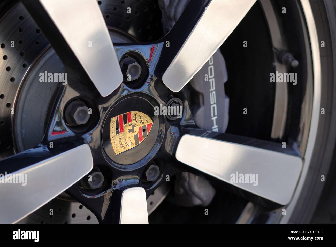 An alloy wheel of Porsche with company logo Stock Photo - Alamy