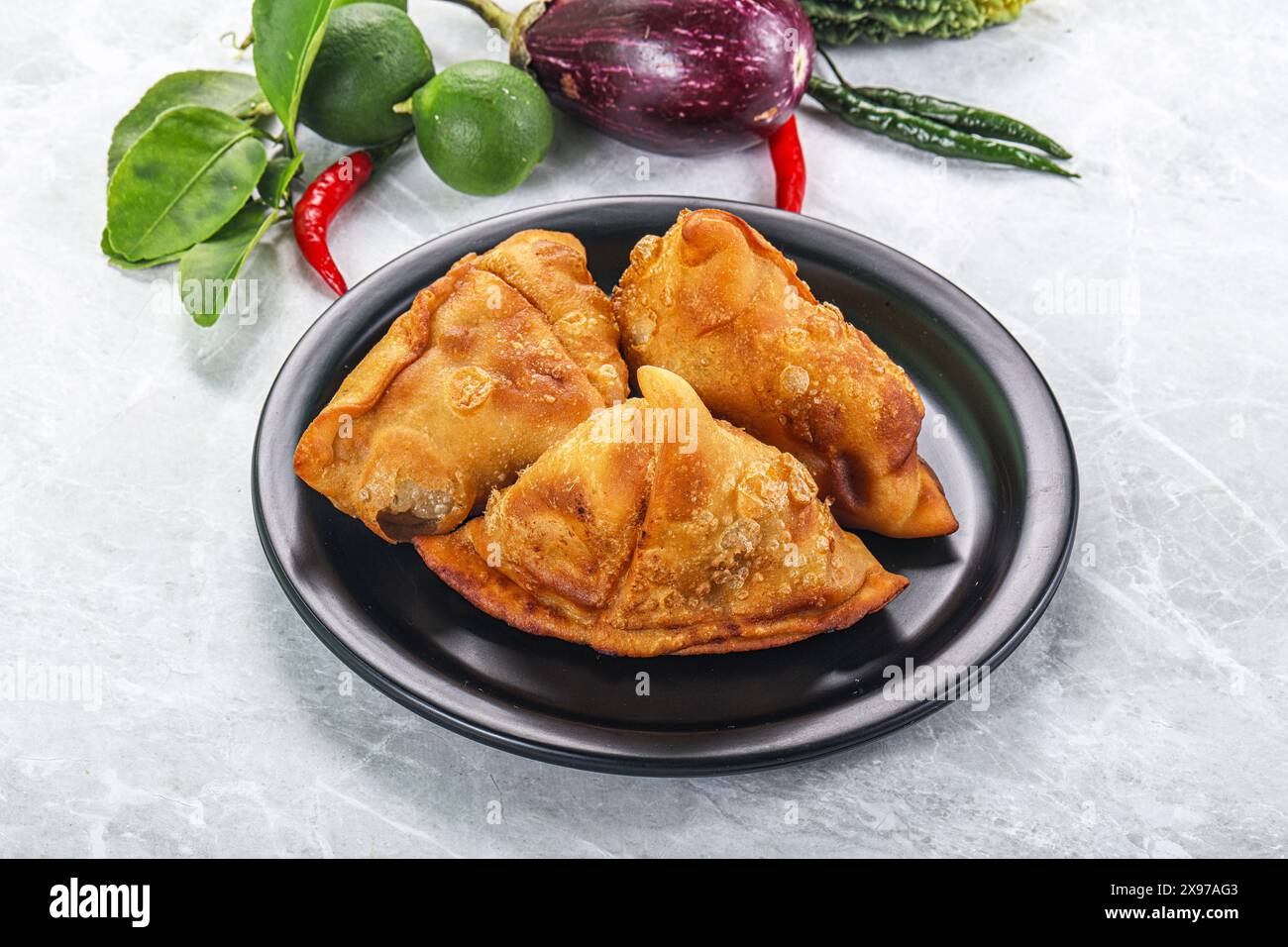 Indian cuisine - fries crispy stuffed samosa Stock Photo - Alamy