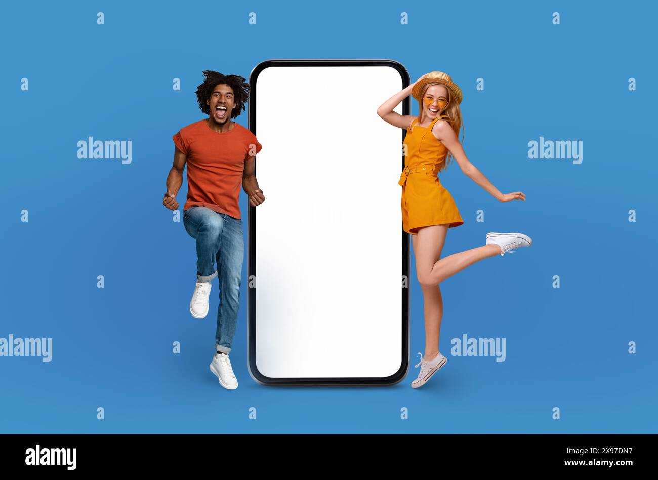 Two People Jumping in Front of Blank Screen, Mockup Stock Photo - Alamy