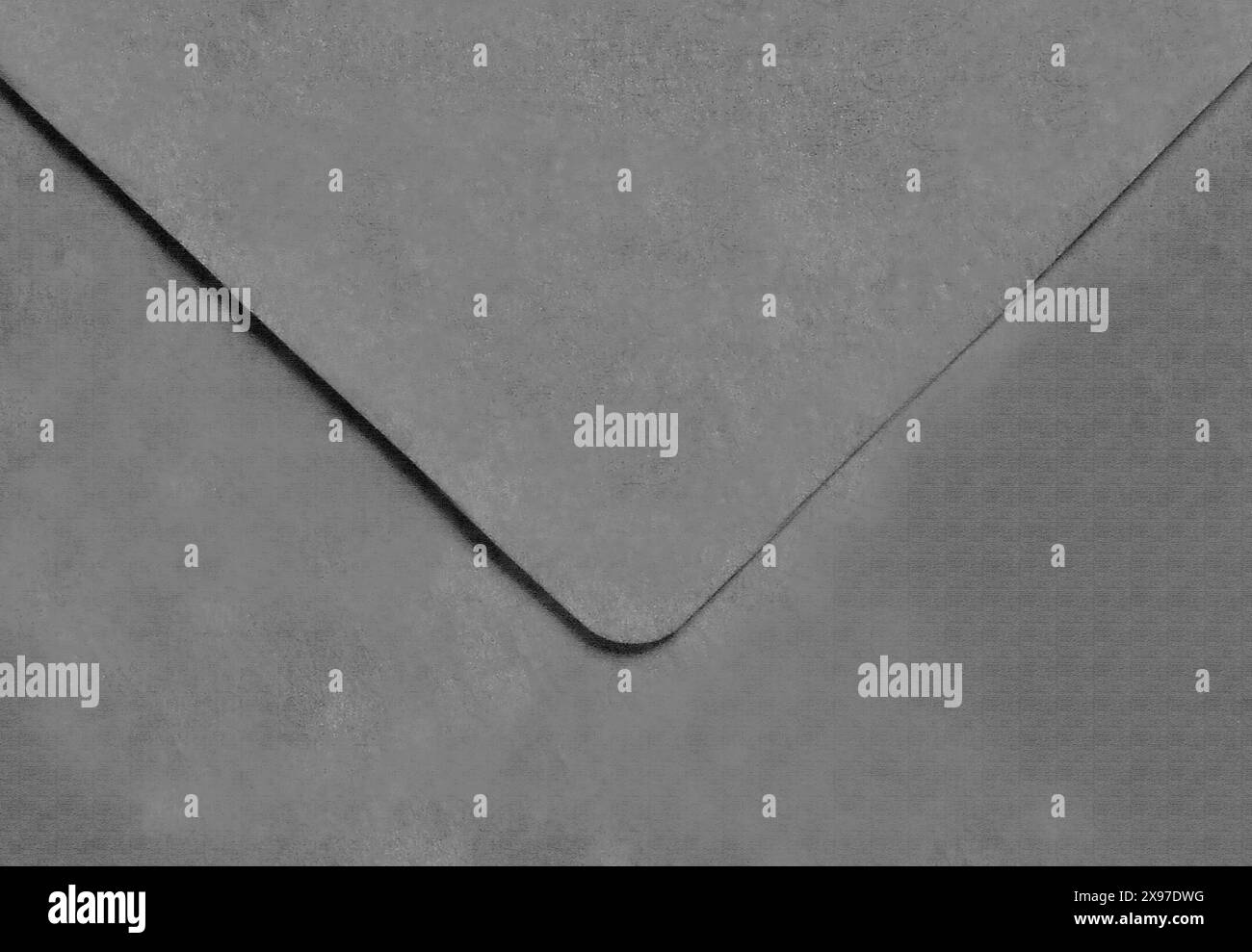 A close-up of a grey envelope with a visible texture, showcasing its ...