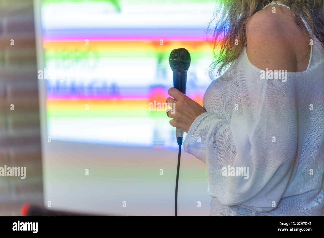 Unrecognizable university teacher teaching with a monitor screen and ...