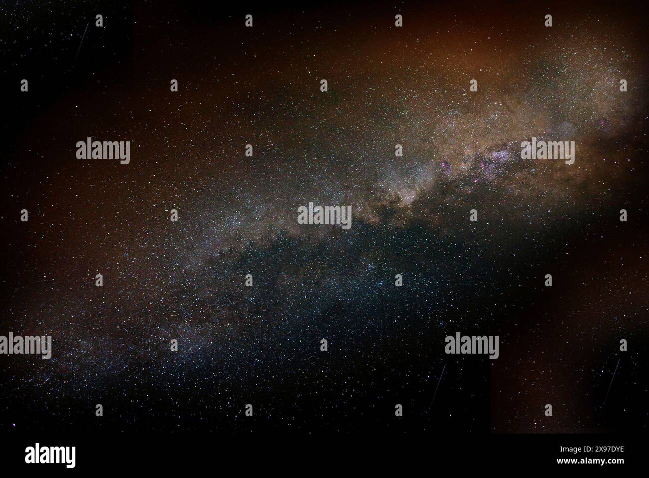 View of the Milky Way galaxy with its dense clusters of stars set against the dark backdrop of ...