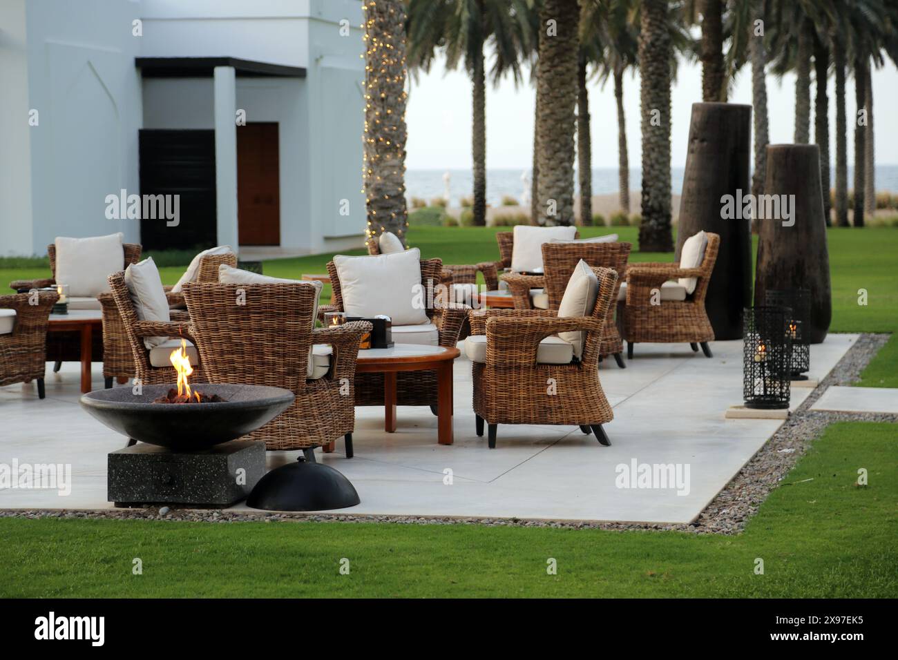 One of the Many Outdoor Dining Areas with a Fire Pit in the Evening ...