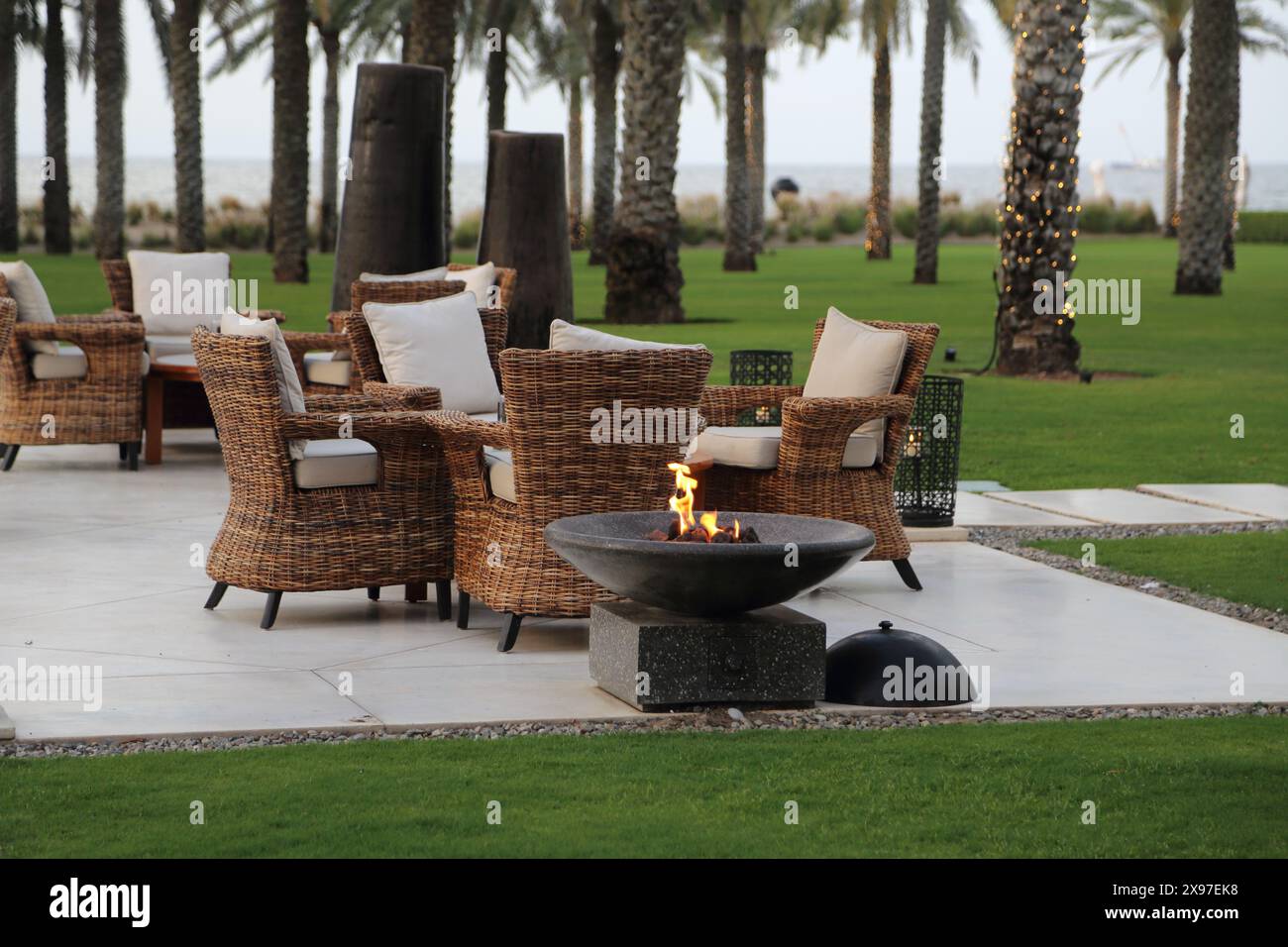 One of the Many Outdoor Dining Areas with a Fire Pit in the Evening ...