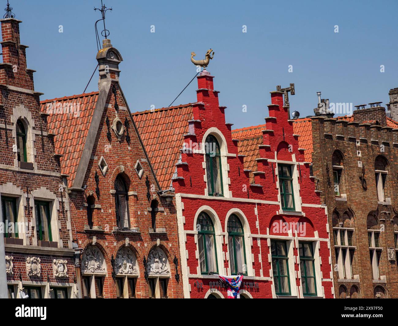 Colourful historic buildings with ornate facades and gables under a ...
