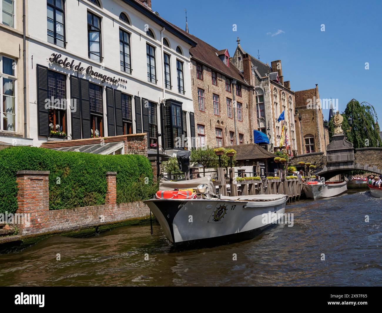 Scenic canal landscape with historic buildings, boats and clear blue ...