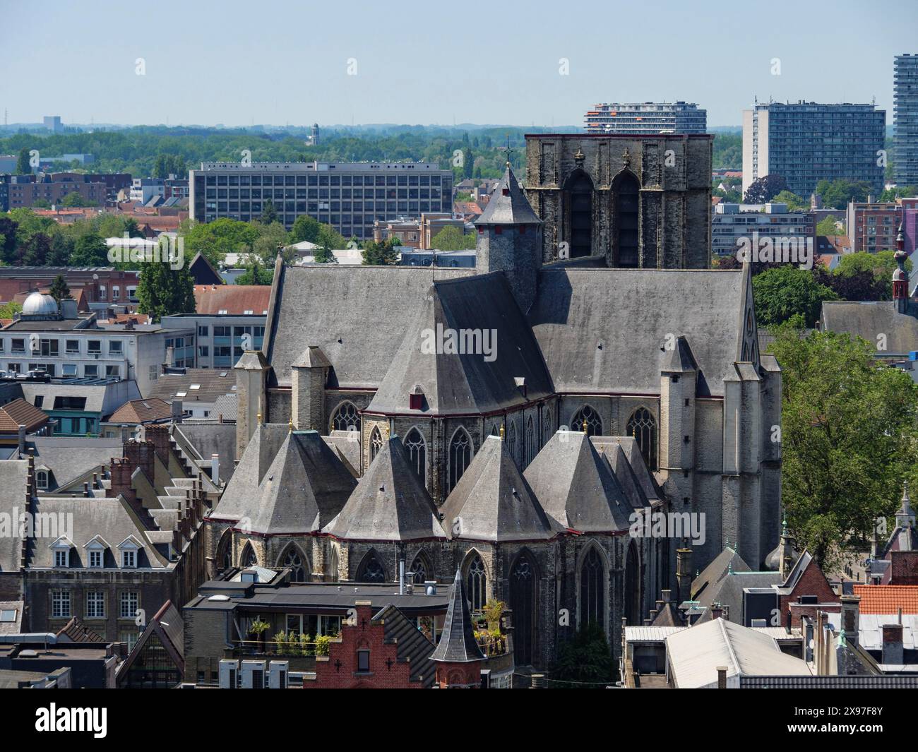 Medieval church with prominent towers and surrounding buildings in a ...