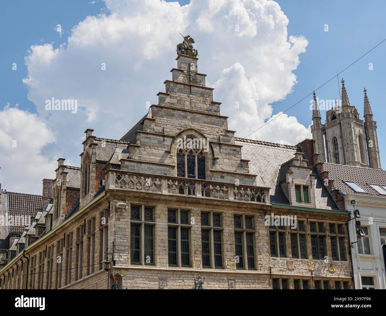 A historic building with Gothic architecture and pointed towers against ...