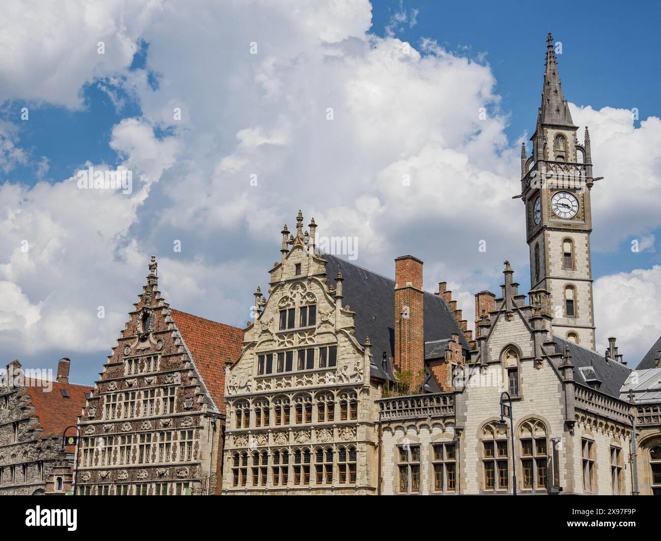 Row of gothic buildings with ornate facades under a clear blue sky with ...