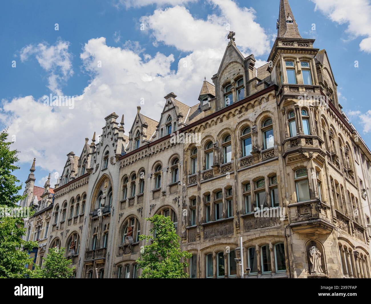 Two-storey building in neo-Gothic style with gabled towers and ornate ...
