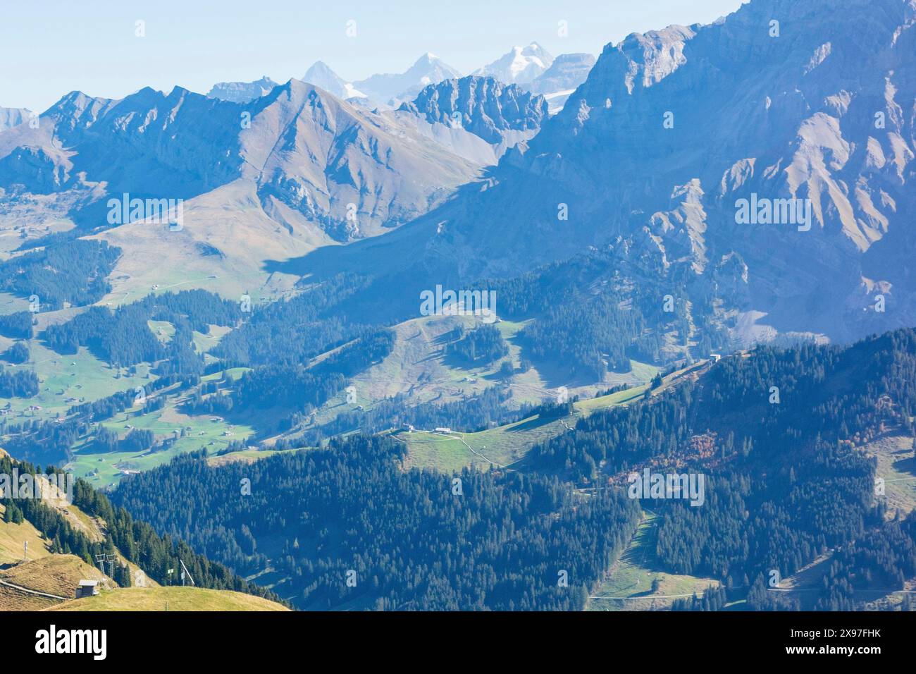 Vast mountain landscape with deep valleys, green forests and ...